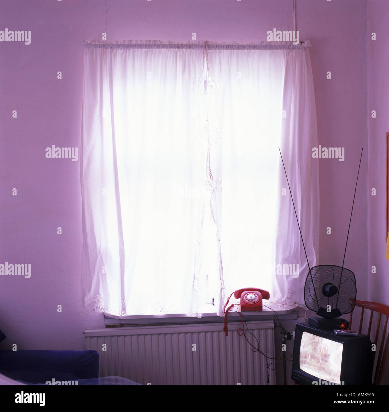 pink room with telefon and tv Stock Photo - Alamy