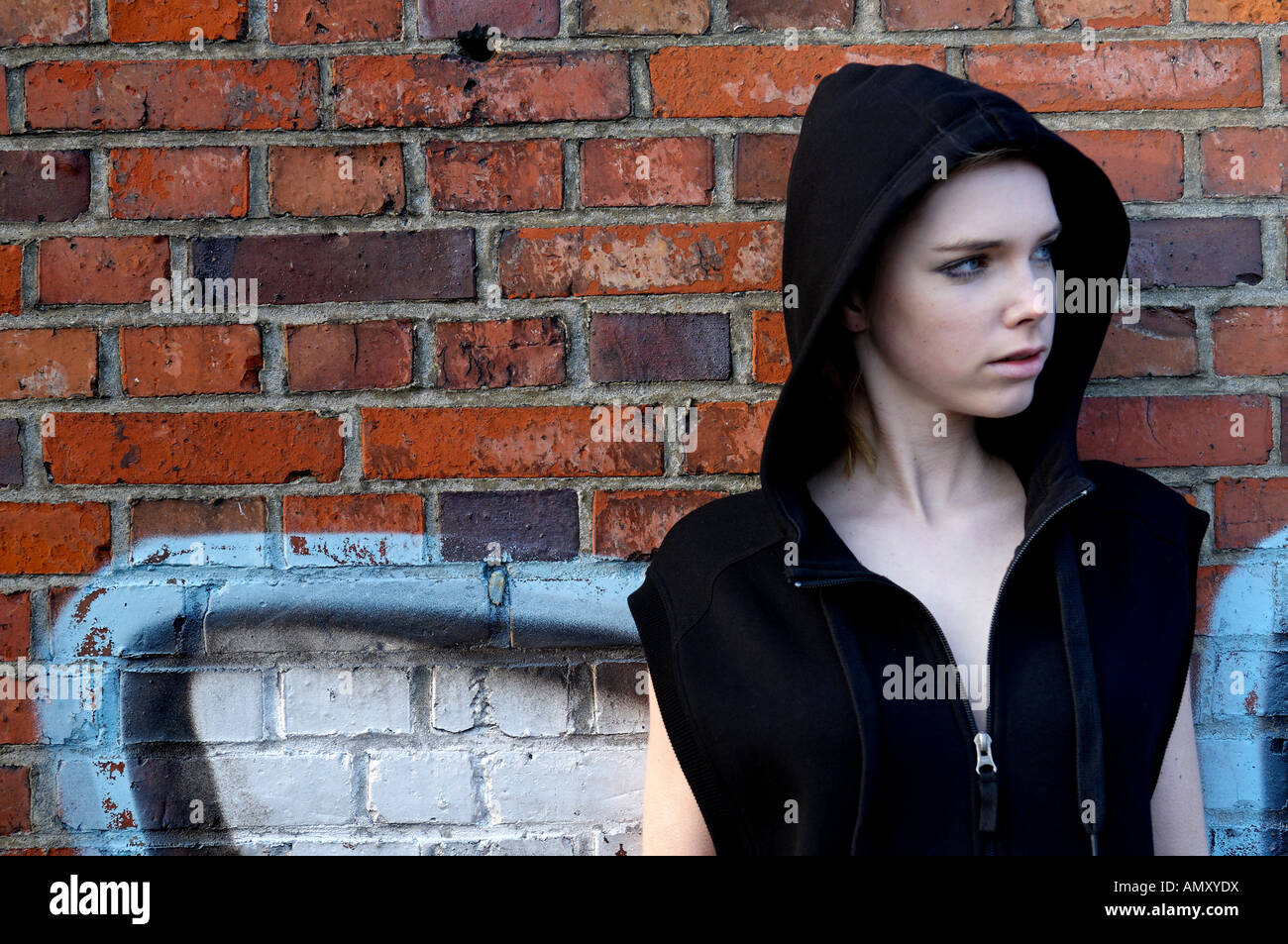 Close-up of young woman looking serious Stock Photo - Alamy