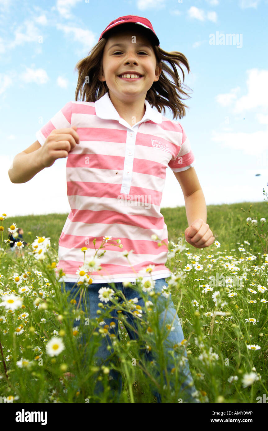 Girl running over meadow Stock Photo - Alamy