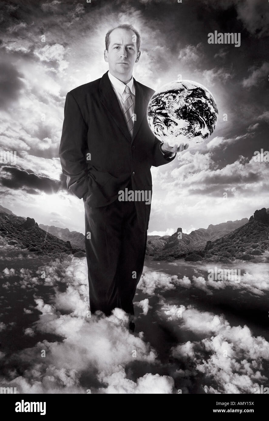 Ian Bartholomew Actor as a business man holding the World standing in ...