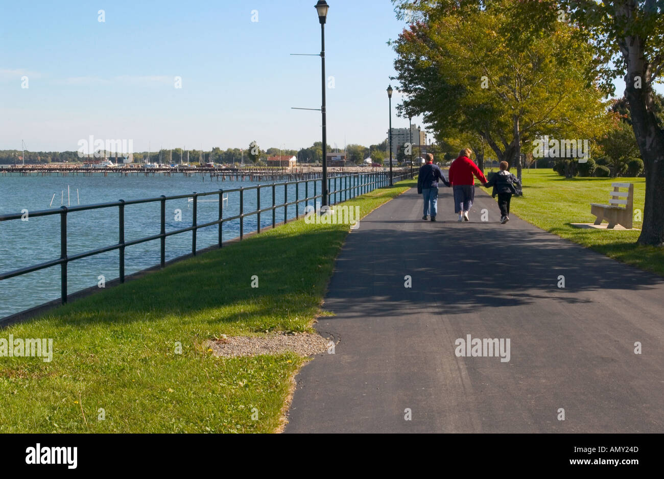 Family walks along path at Dunkirk Yacht Club New York USA Stock Photo ...