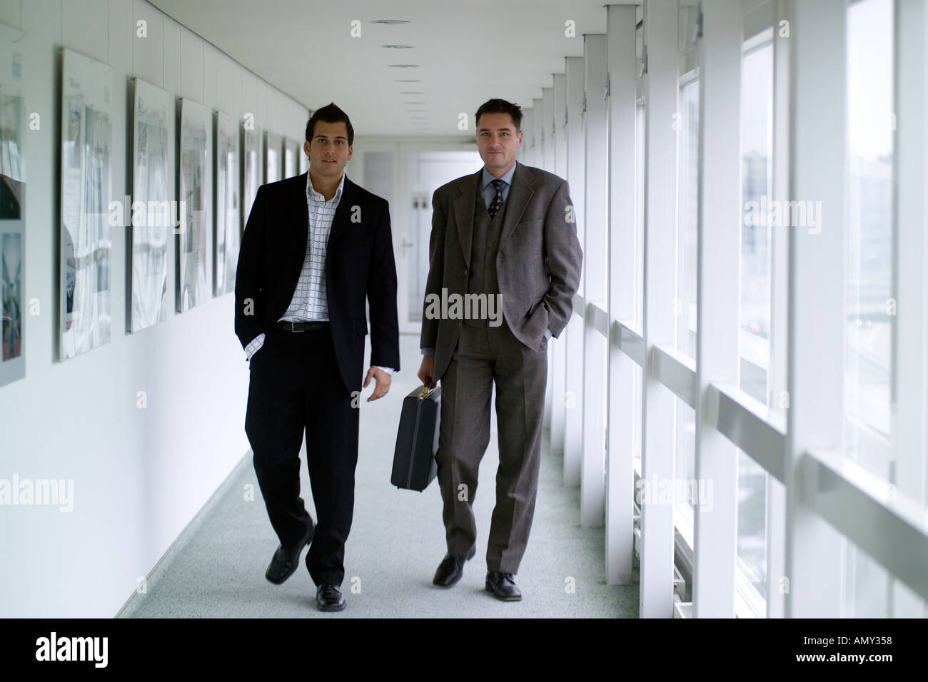 Walking group of men in suits hi-res stock photography and images - Alamy