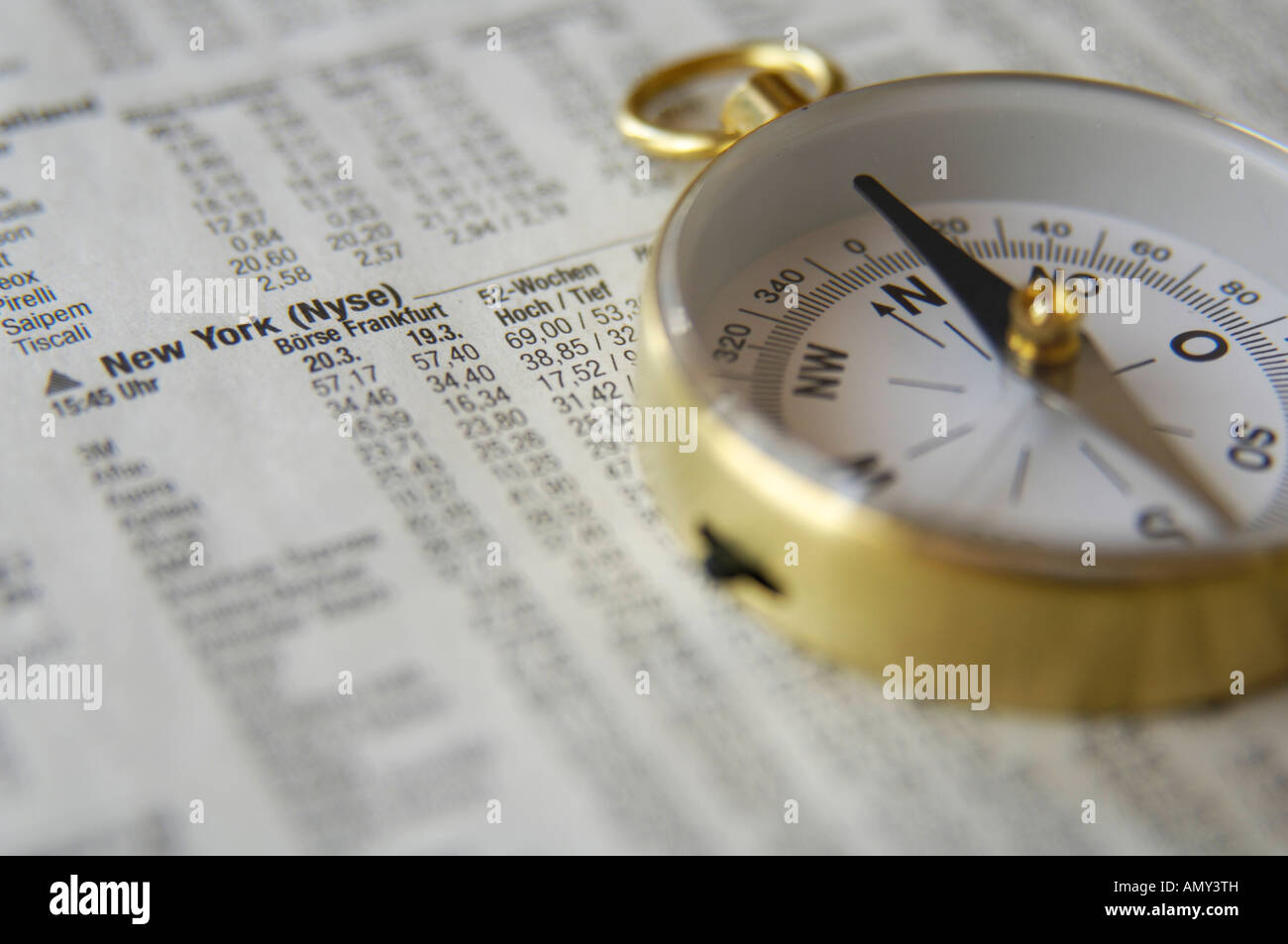 High angle view of compass on newspaper Stock Photo - Alamy