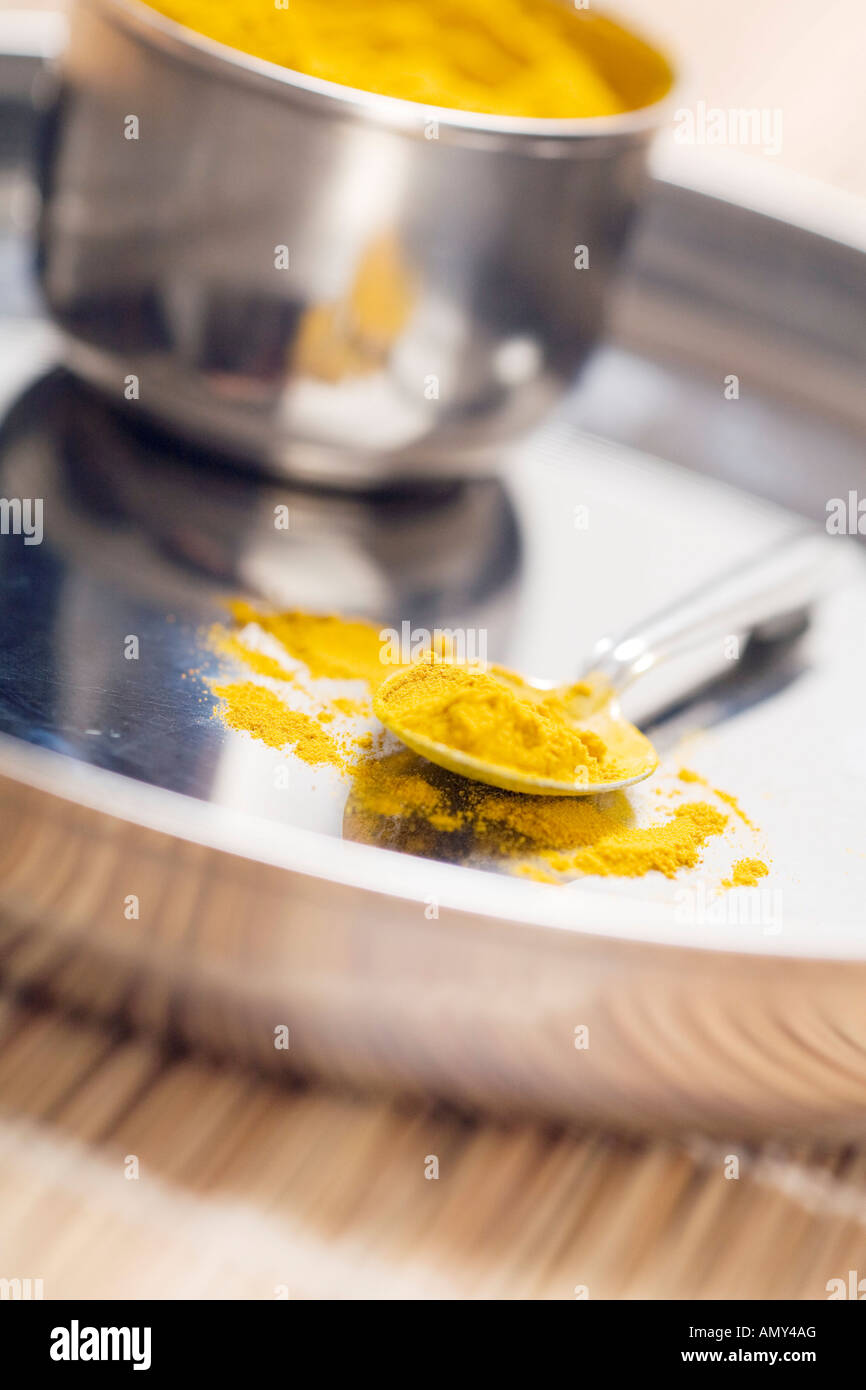 Close-up of turmeric powder on spoon Stock Photo - Alamy