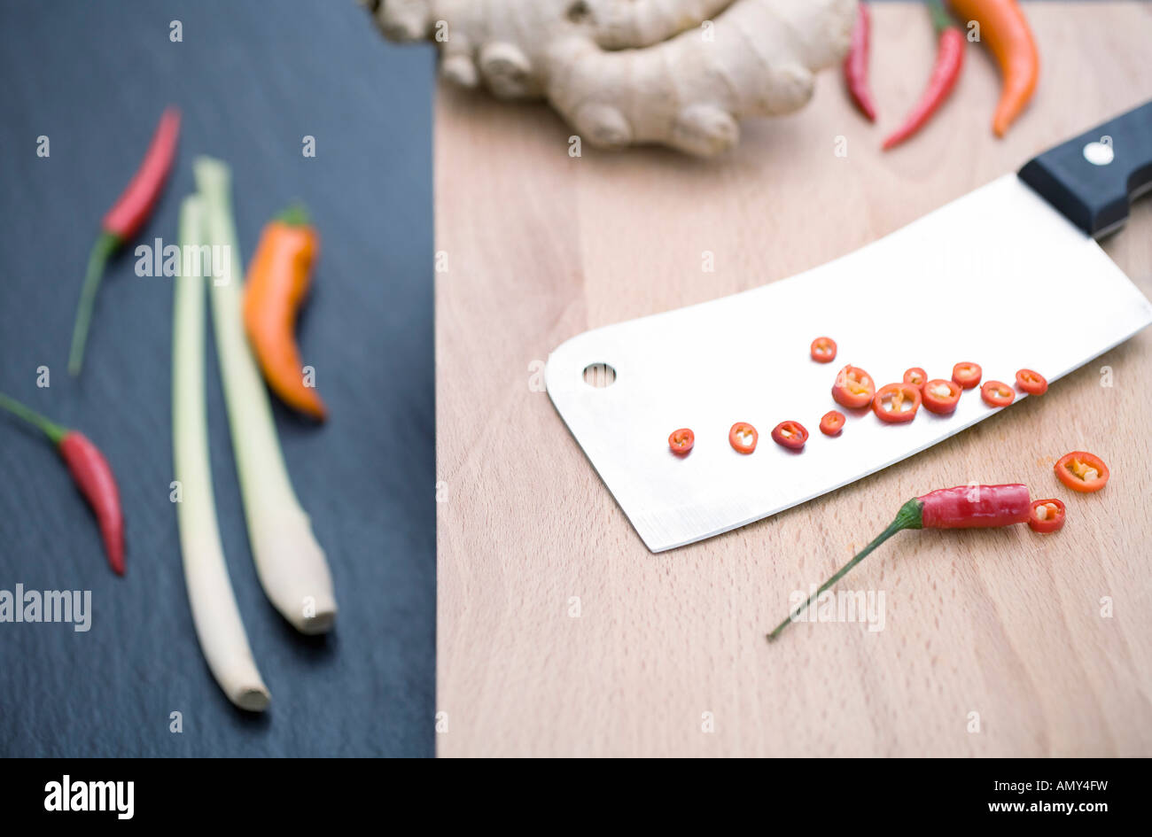 Chopped red chilli peppers on meat cleaver Stock Photo - Alamy