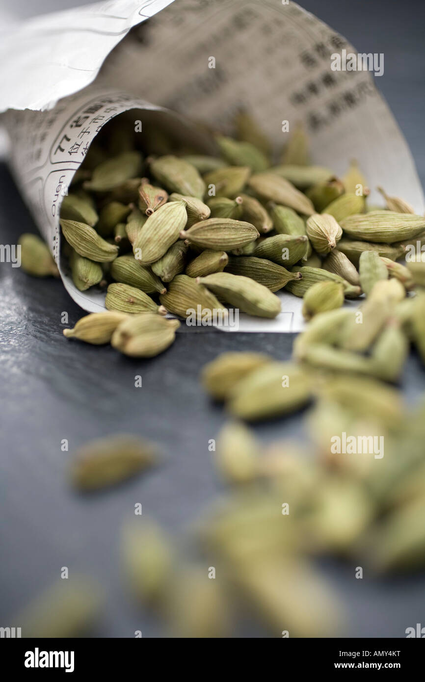 Close-up of cone with cardamom falling out Stock Photo - Alamy