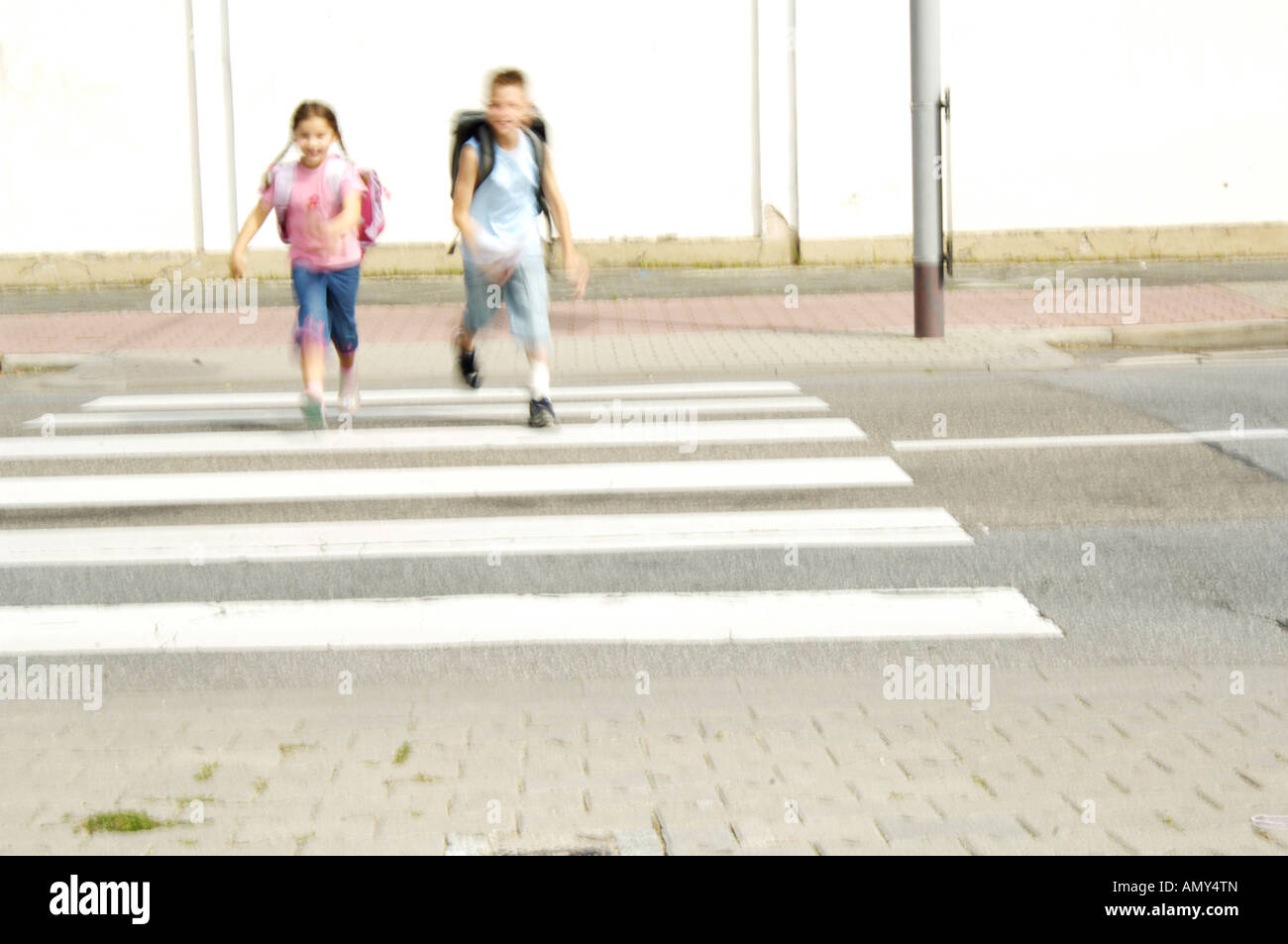 Boy and girl zebra crossing Stock Photo - Alamy