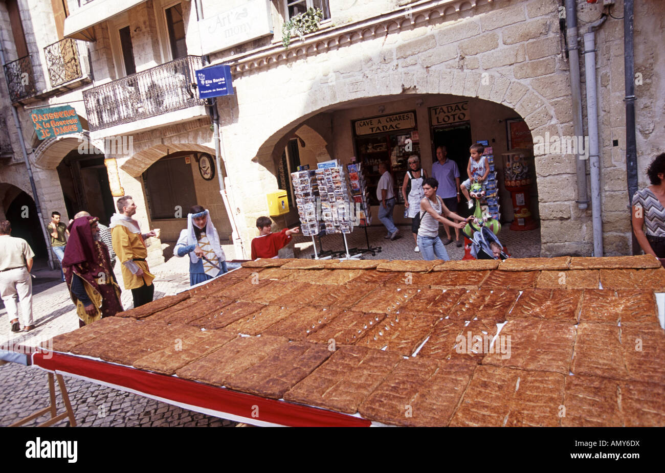 Giant fougasse in the street of medieval village of Sommieres during ...