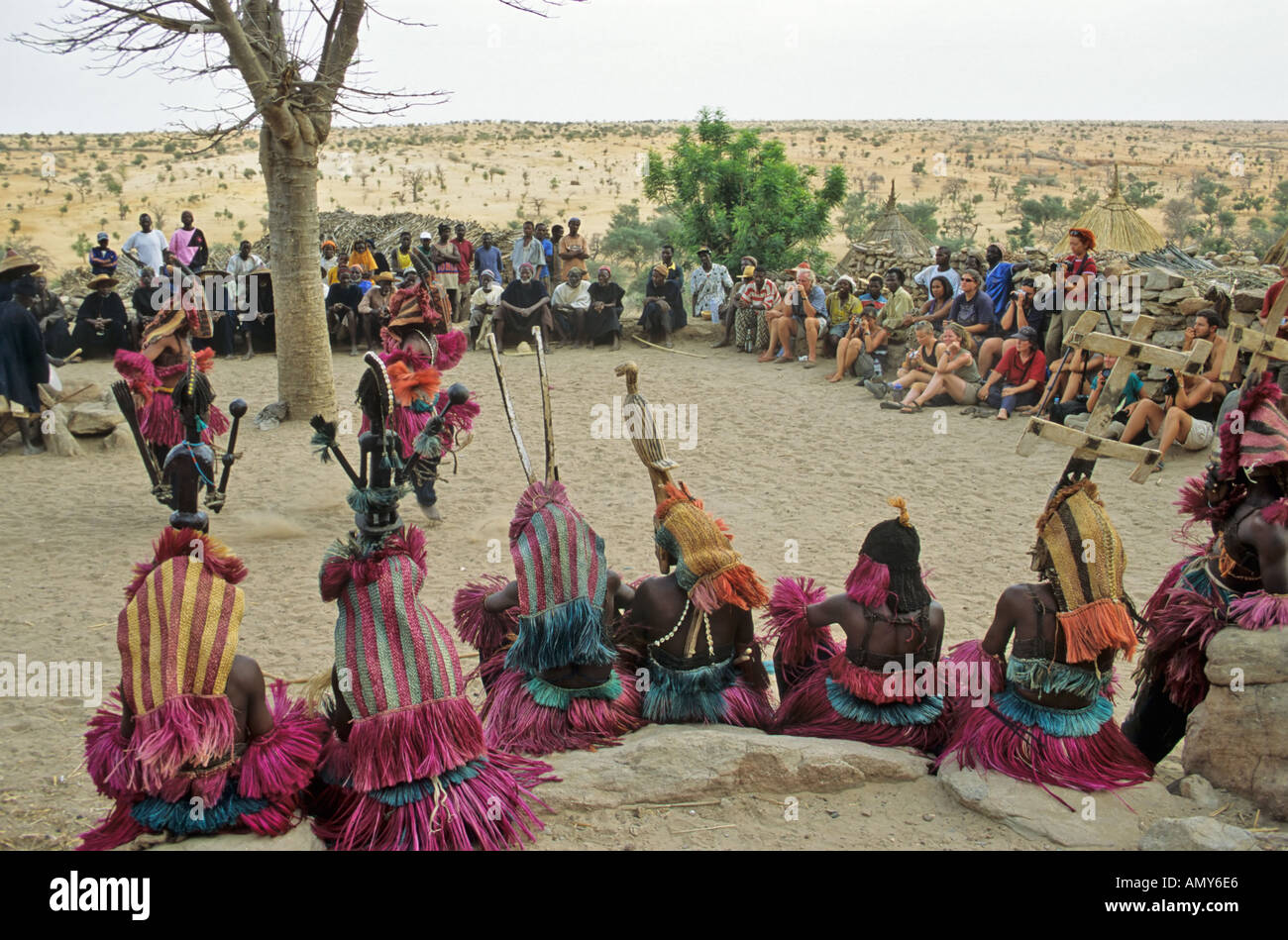 Group of tourists watching the Dogon Mask Dance, Tirelli, Mali Stock ...