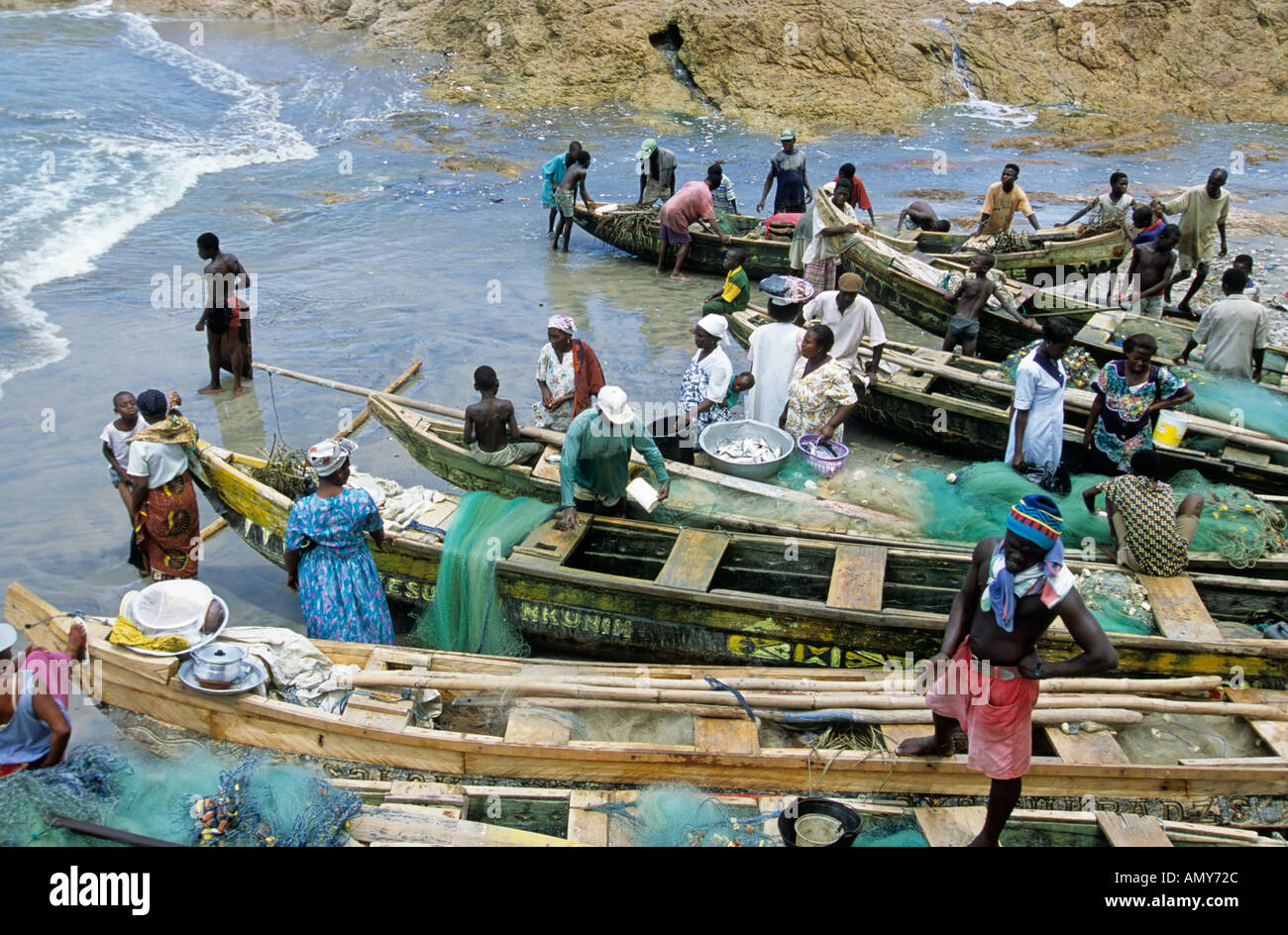 Fishing boats and fishermen, Cape Coast, Ghana Stock Photo - Alamy