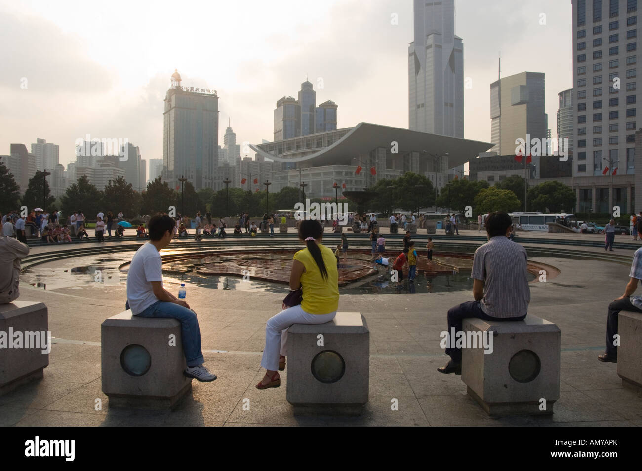 China Shanghai Renmin square area backlit view of people sitting in ...