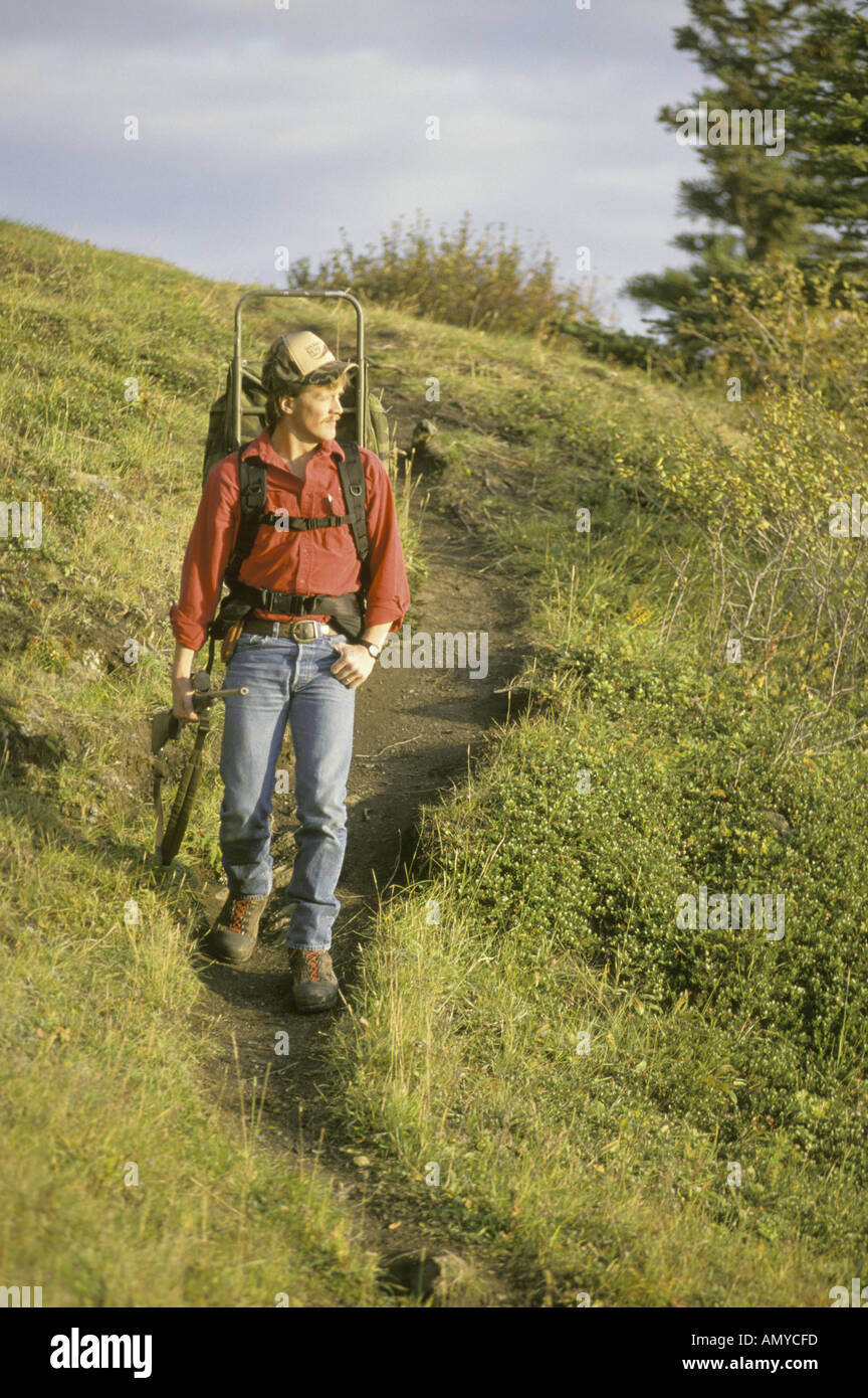 Hunter Hiking on Trail w Backpack and Gun Alaska Stock Photo - Alamy