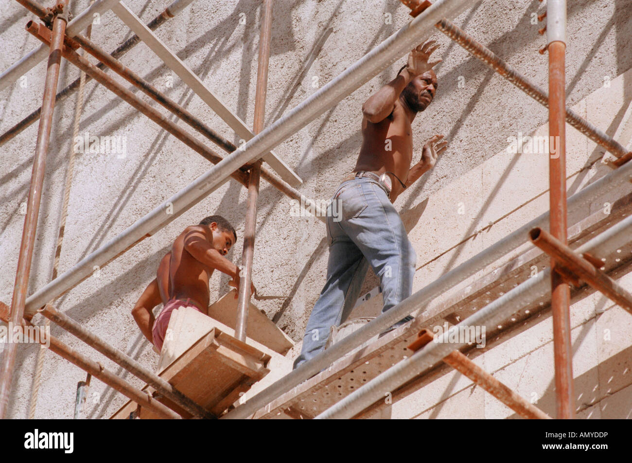 Construction workers in Havana Cuba, working on the restoration of the ...