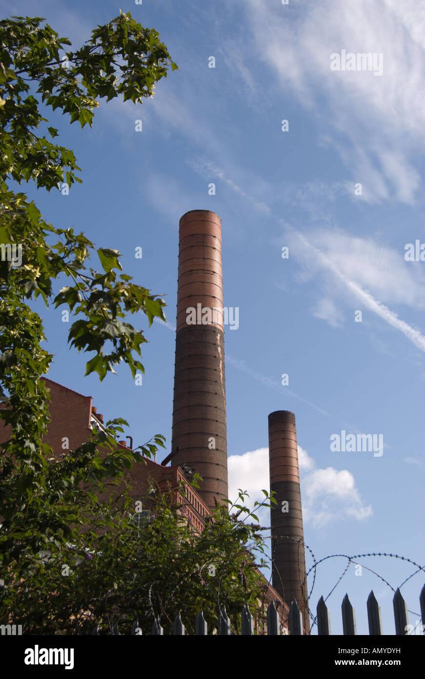 The two chimney of lots road power station, seen against a blue sky ...