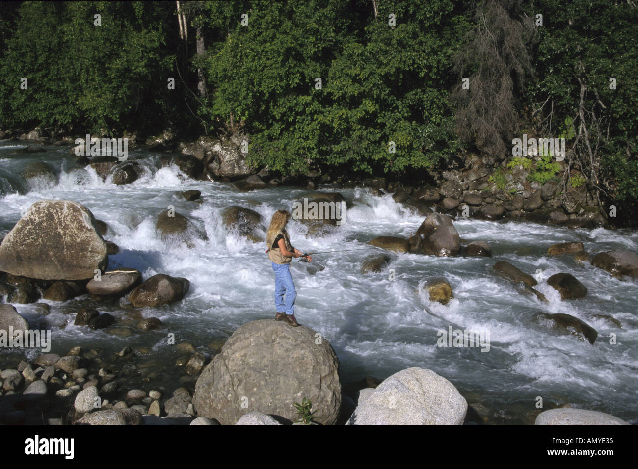 Woman fishing Little Susitna River Hatcher Pass SC Alaska summer scenic ...