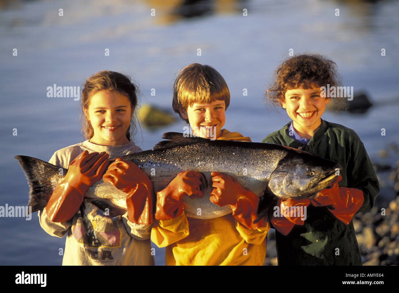 Kids holding King Salmon Juneau Southeast AK summer portrait Stock ...