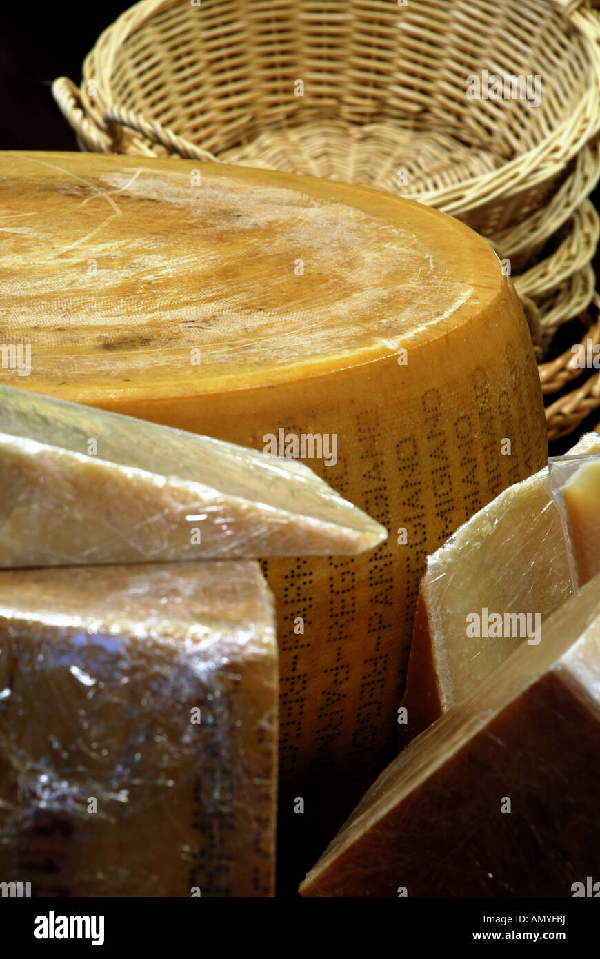 Wedges and round of parmesan cheese Stock Photo - Alamy
