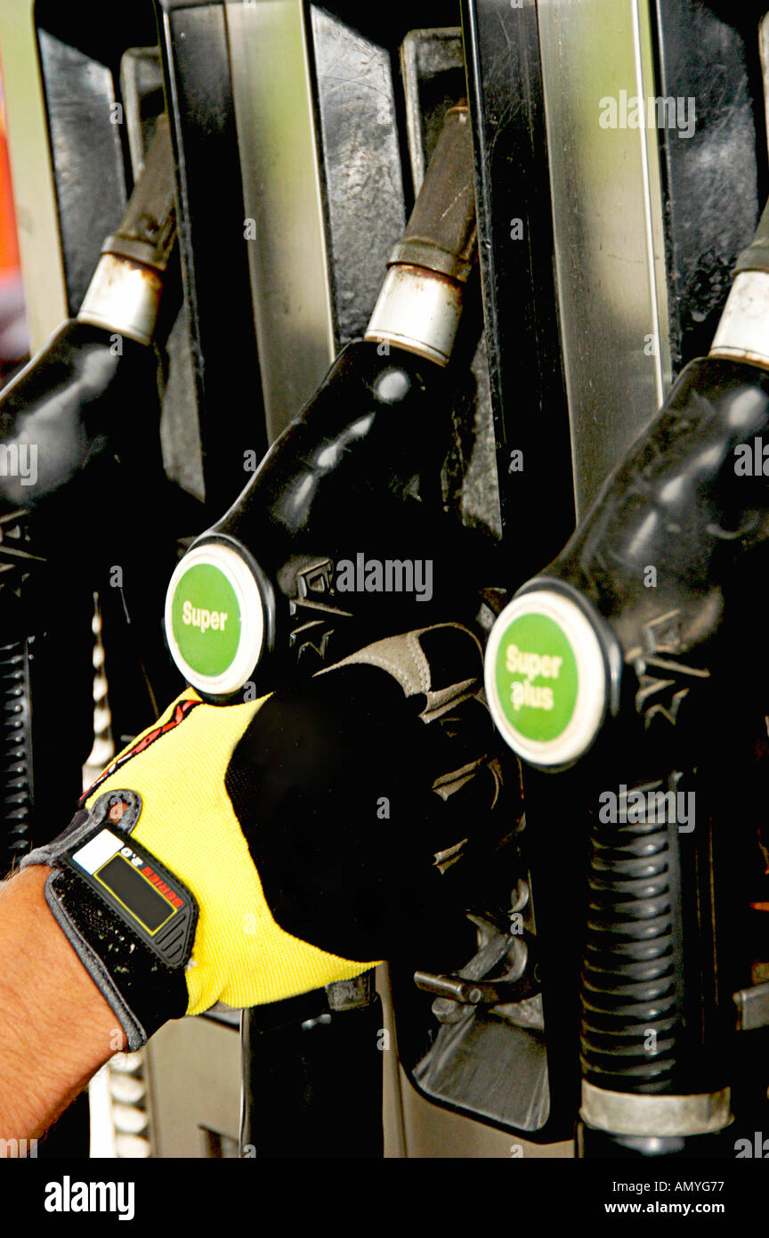 A hand grabs the Fuel tab Stock Photo - Alamy