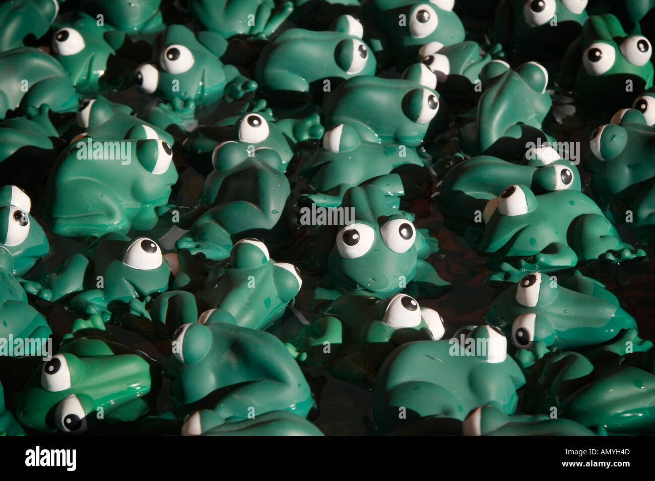 Green rubber plastic toy frogs hi-res stock photography and images - Alamy