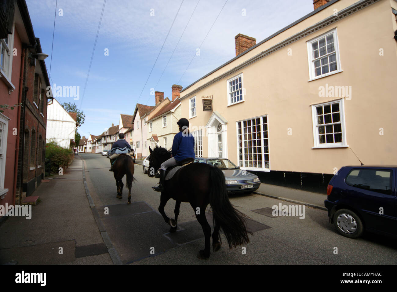 Horses riding up Water Street Lavenham Suffolk East Anglia UK Stock ...