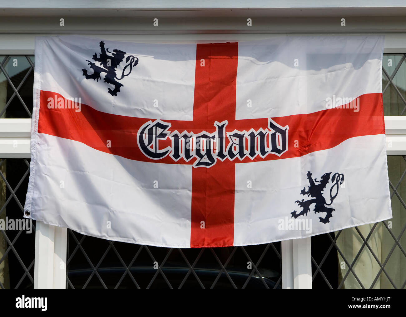 England flag attached to window Stock Photo - Alamy