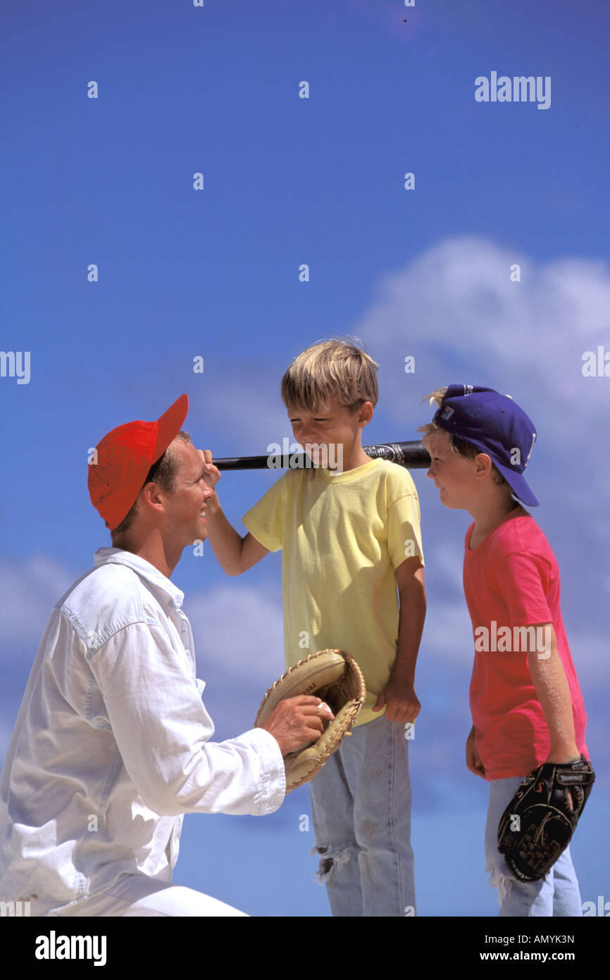 Father teaching child baseball hi-res stock photography and images - Alamy