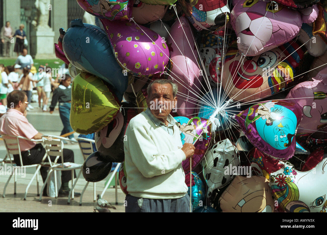 GRUMPY MAN SELLS BALLOONS IN MADRID Stock Photo - Alamy