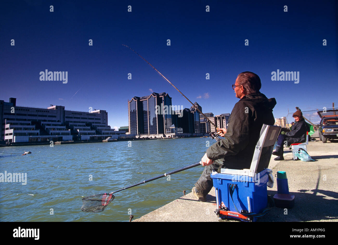 TWO MEN FISHING IN POOL OF LONDON Stock Photo - Alamy