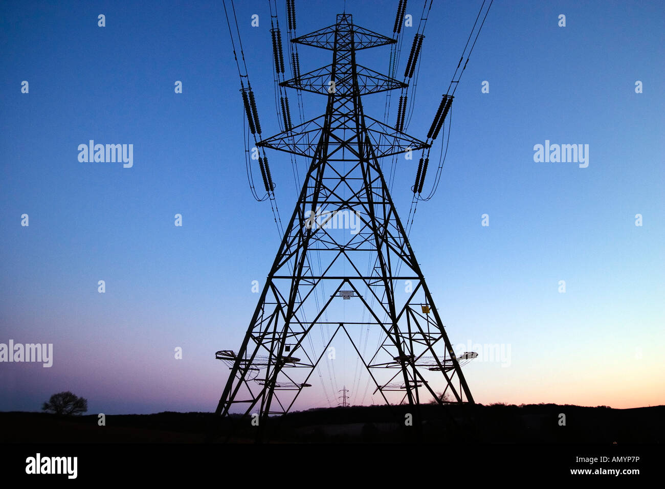 Pylon in the landscape on a clear cold evening Stock Photo - Alamy