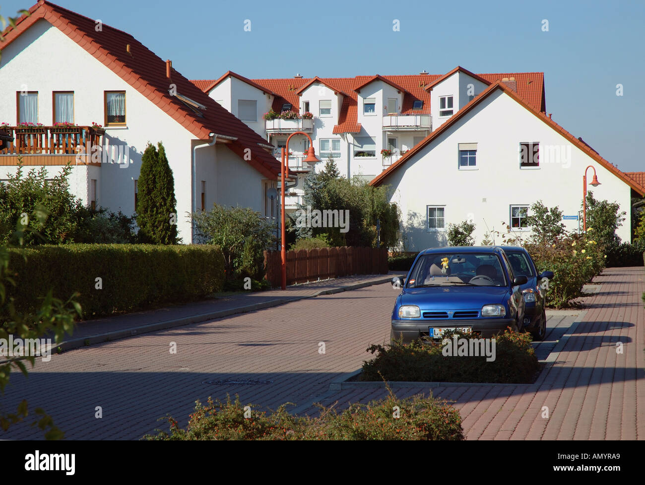 New building settlement with a family and terraced houses Stock Photo ...