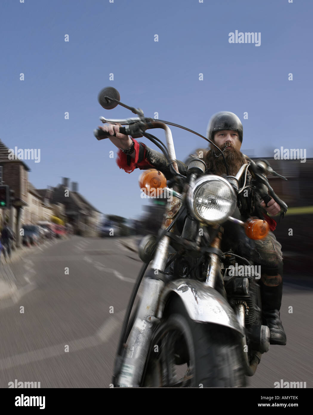Biker riding motor cycle Stock Photo - Alamy