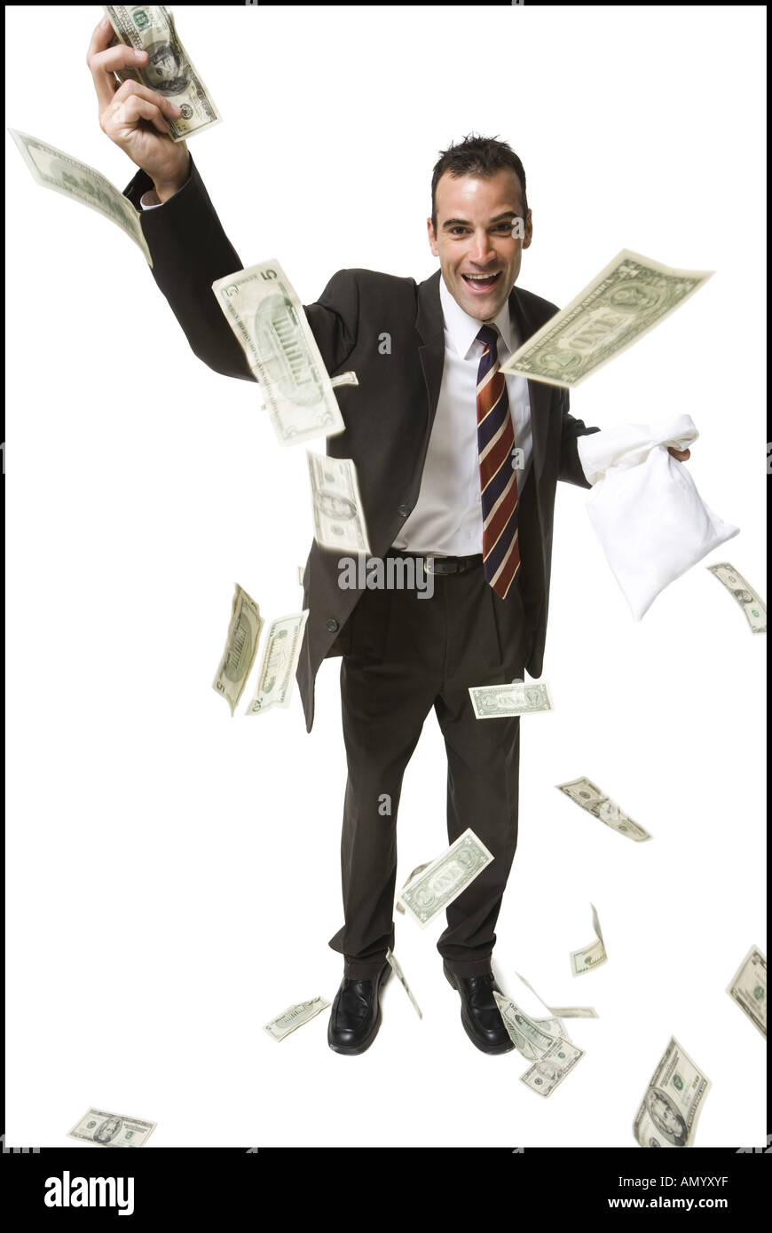 Portrait of a businessman throwing money Stock Photo - Alamy