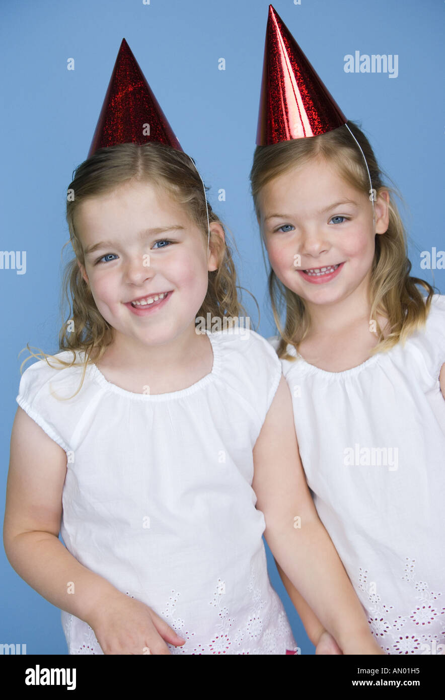 Standing looking at camera childhood smiling side by side hat hi-res ...