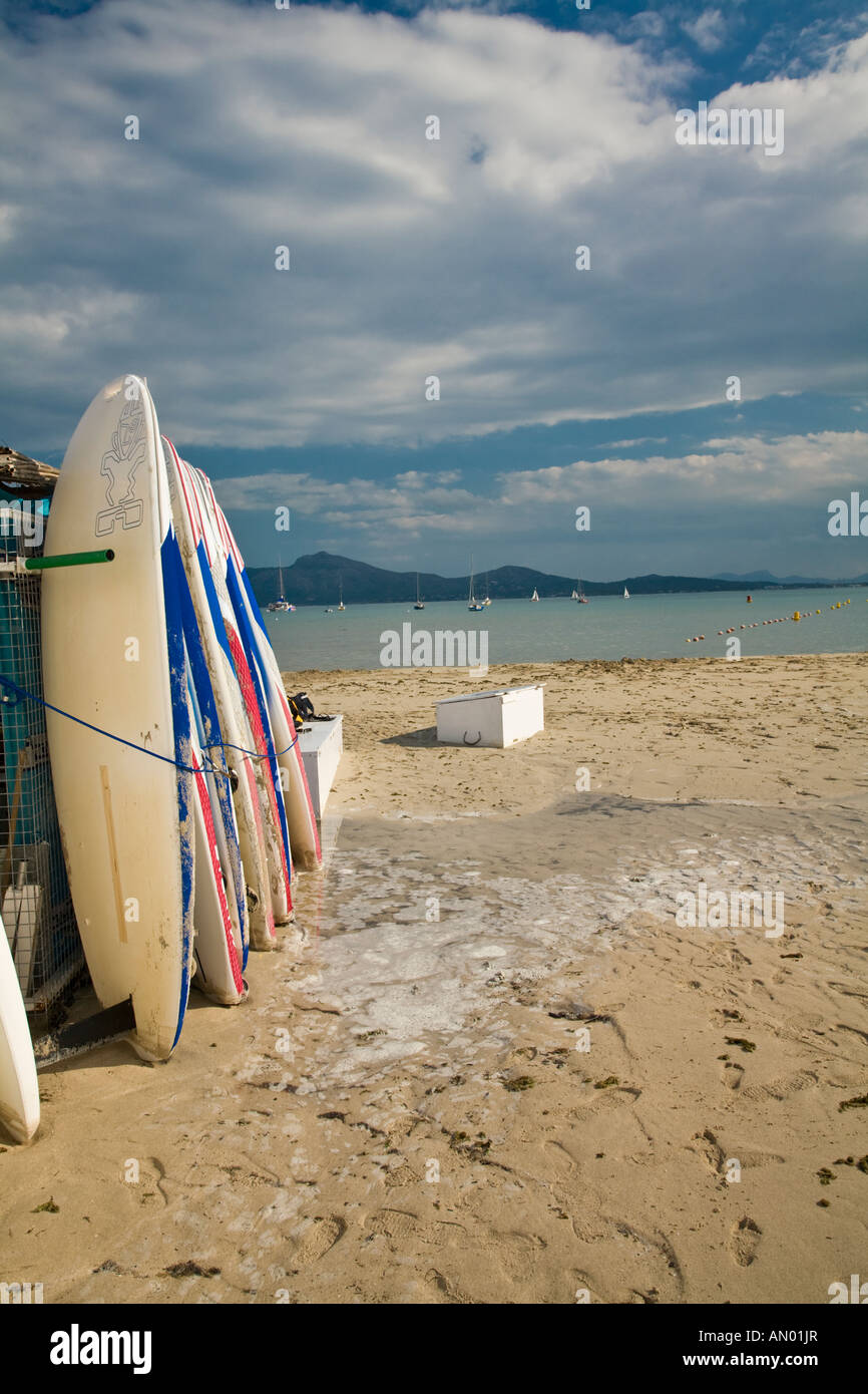 Stacked surf boards on the beach at Port de Pollenca Majorca Balearic ...