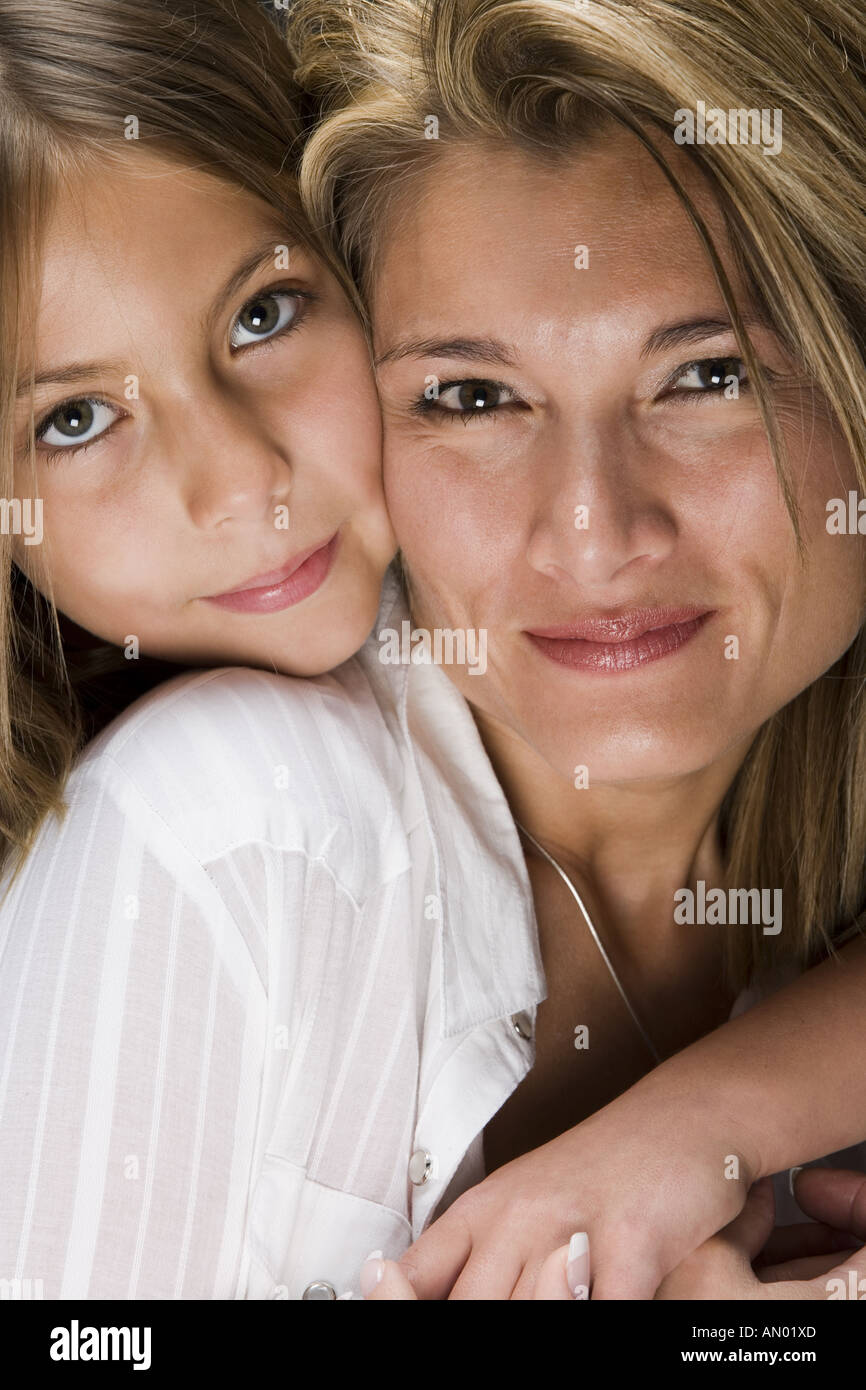 Portrait of a daughter hugging her mother Stock Photo - Alamy
