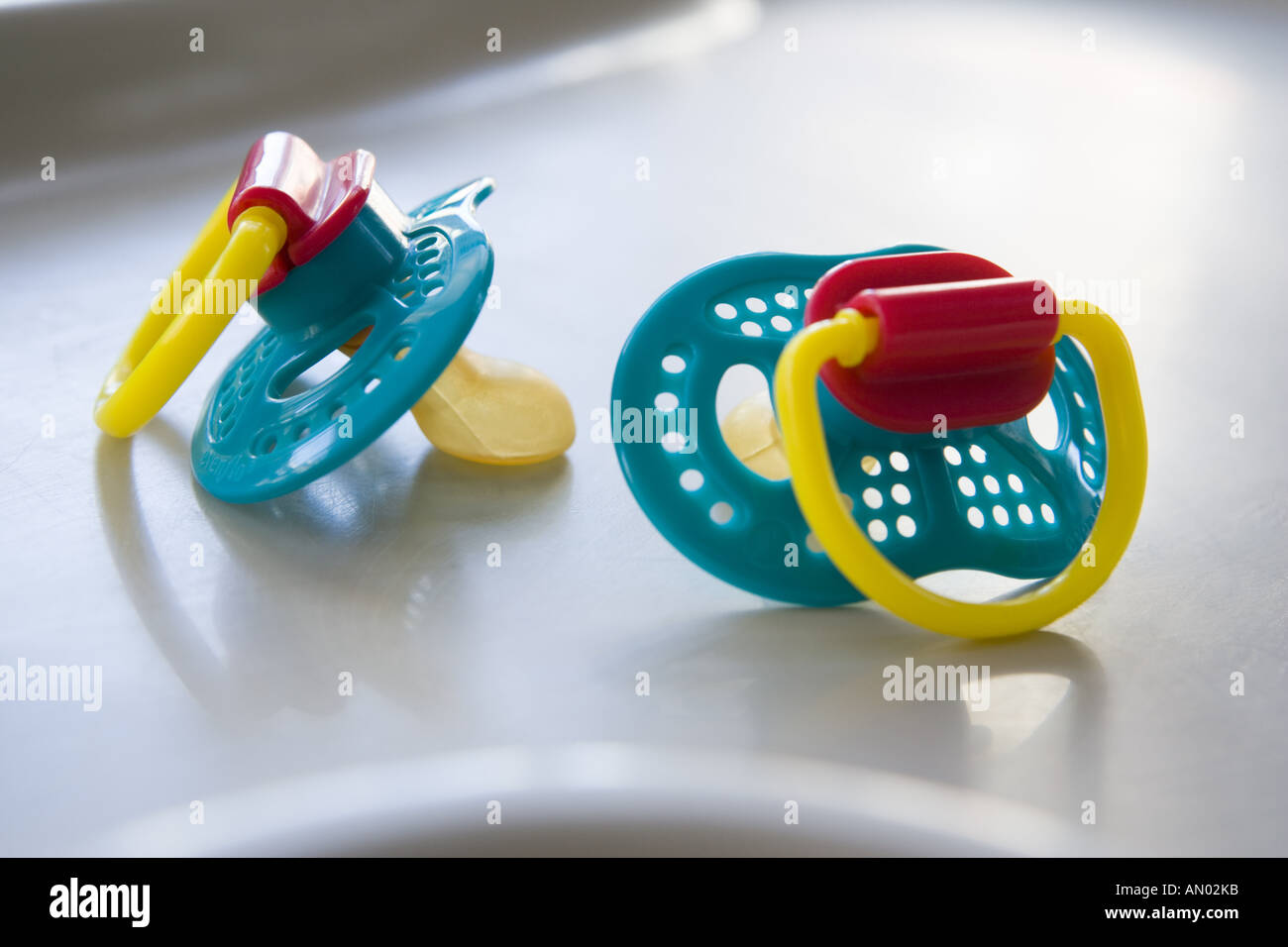 Two baby pacifiers Stock Photo - Alamy