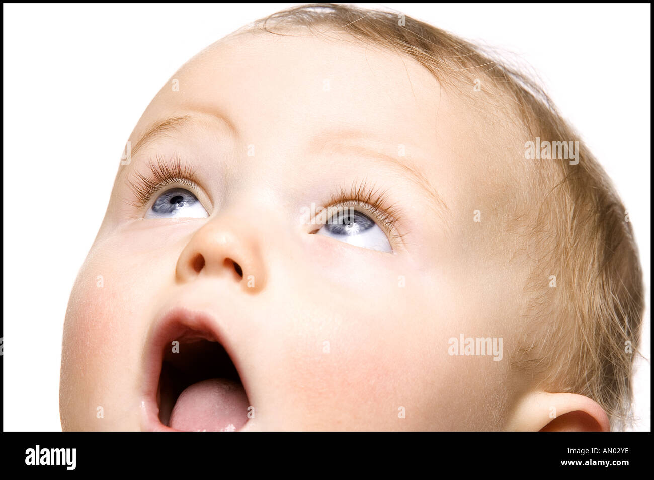 Close up of a baby with open mouth Stock Photo - Alamy