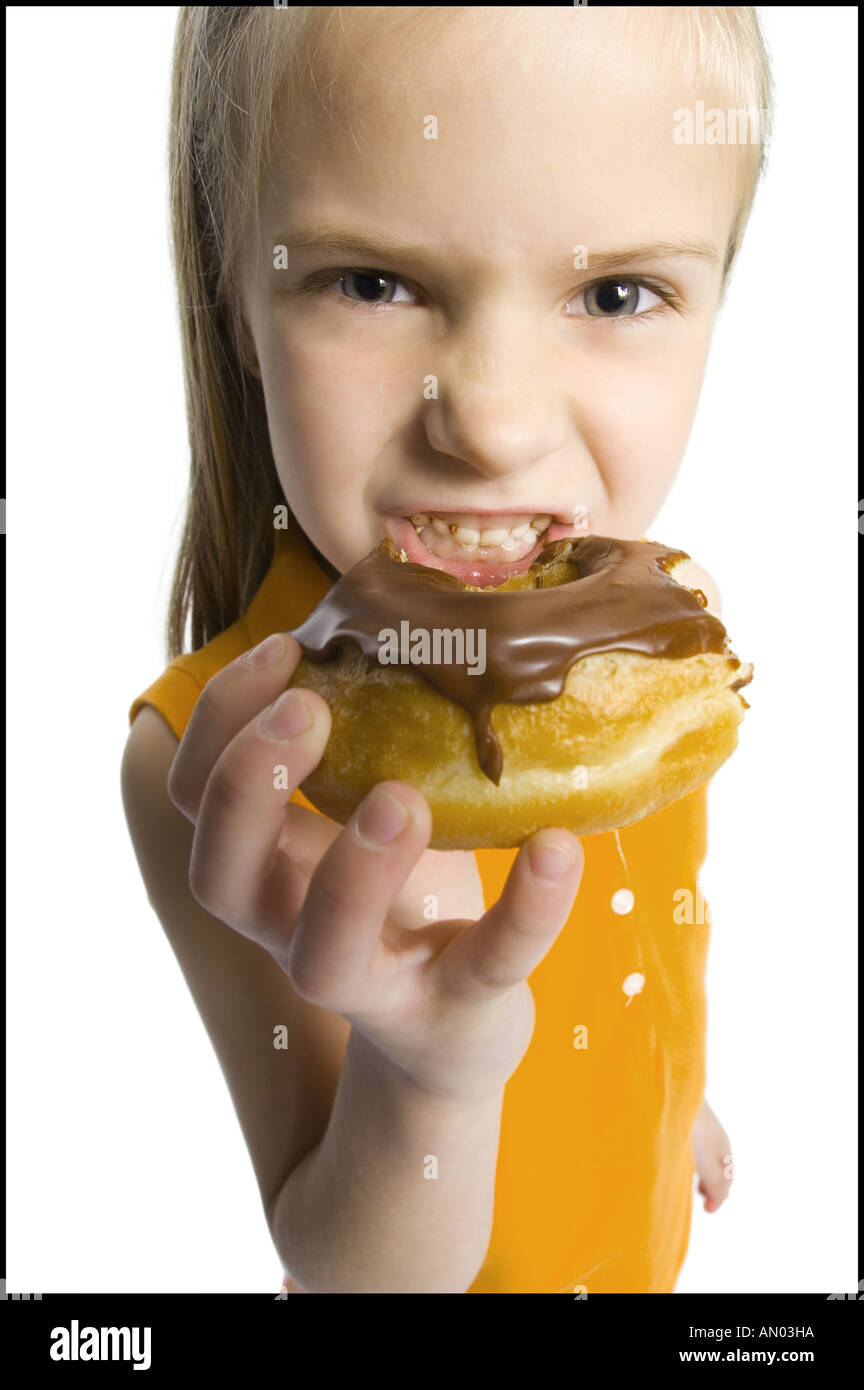 Profile of a girl eating a donut Stock Photo - Alamy