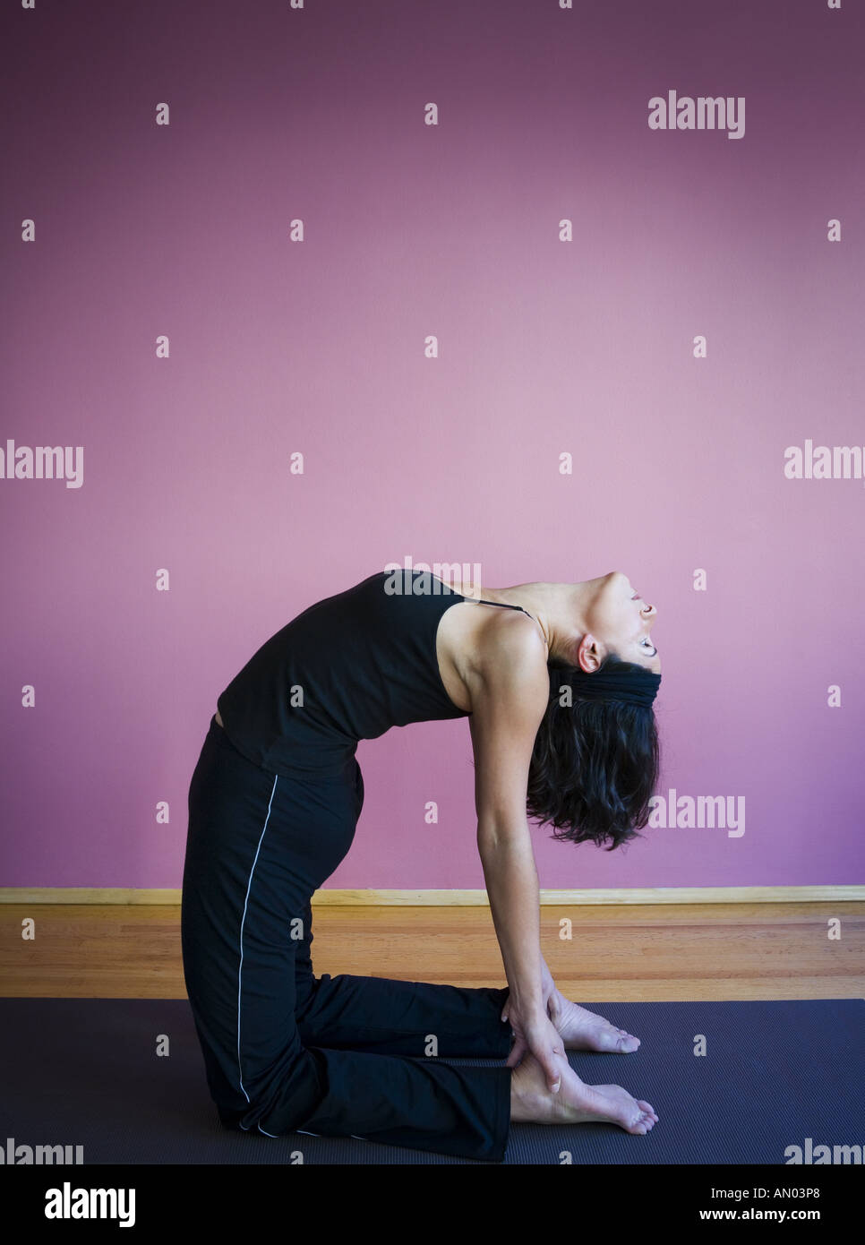Profile of a young woman bending over her backwards Stock Photo - Alamy