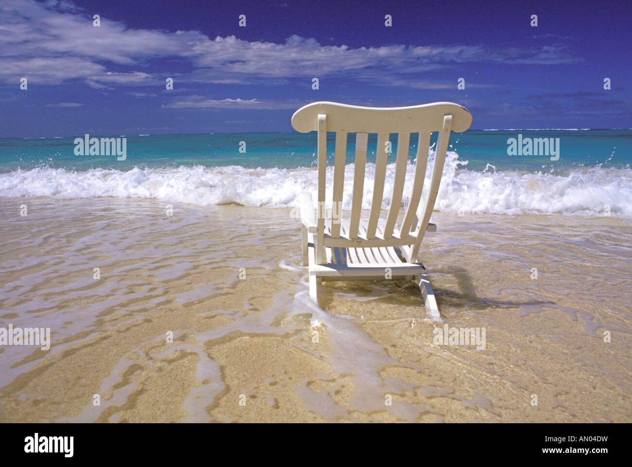 USA, Hawaiian Islands. Beach chair in surf Stock Photo - Alamy