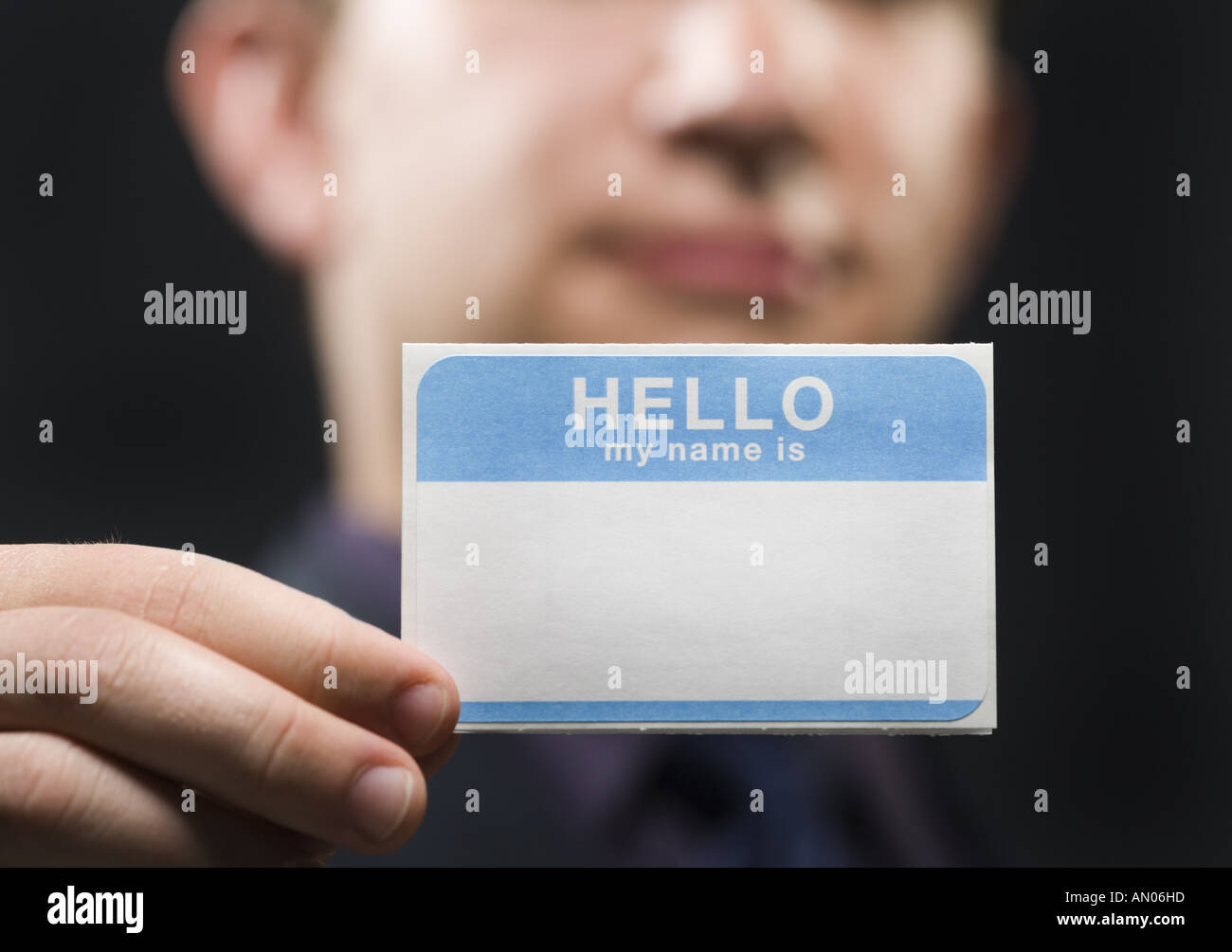 Man holding blank name tag hi-res stock photography and images - Alamy
