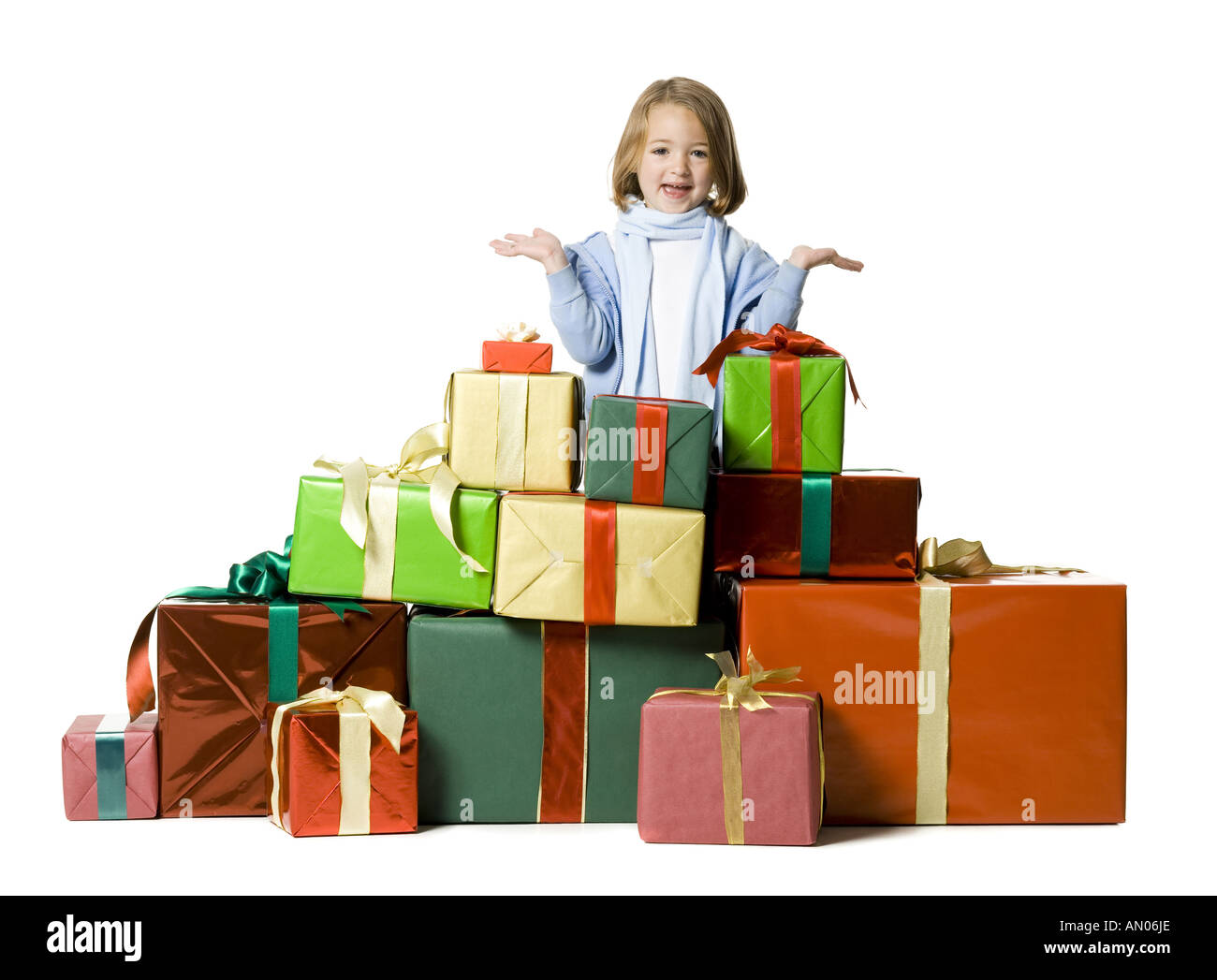 Portrait of a girl standing behind a stack of gifts Stock Photo - Alamy