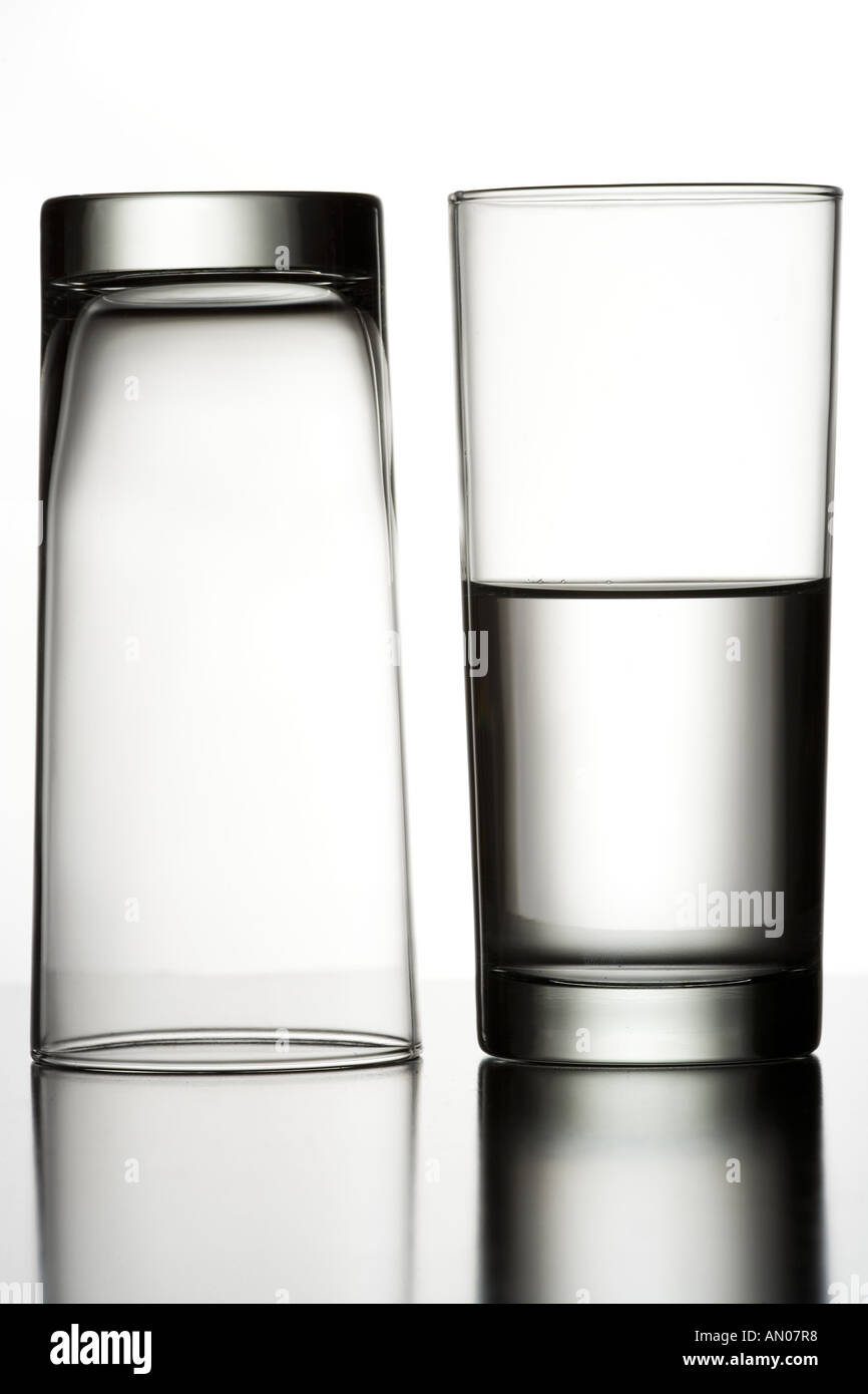 Upside down glass and glass of water Stock Photo - Alamy