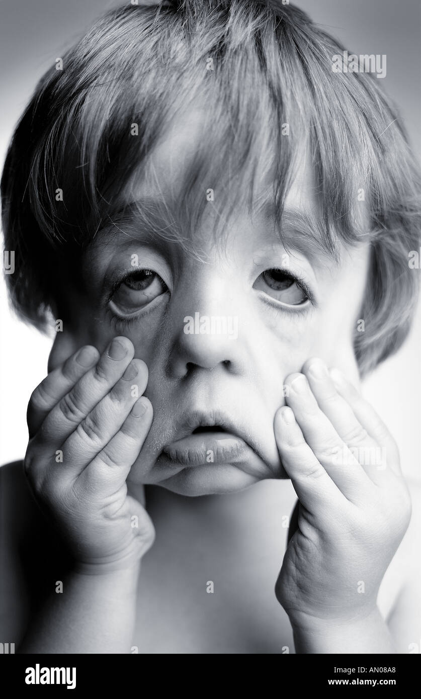 boy pulling a ugly face and looking disturbed Stock Photo - Alamy