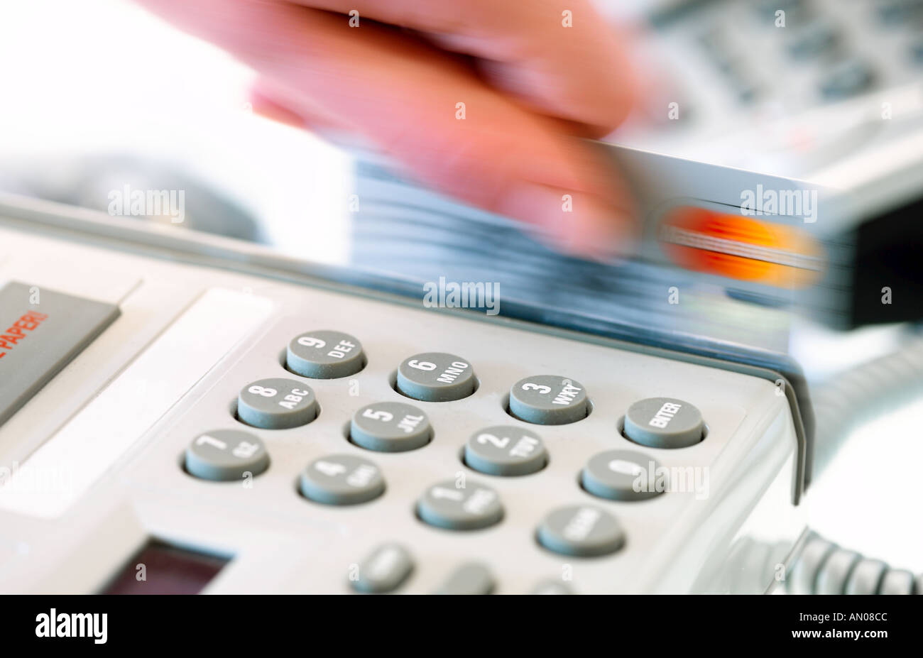 shopper using credit card to pay for goods at shop till Stock Photo - Alamy