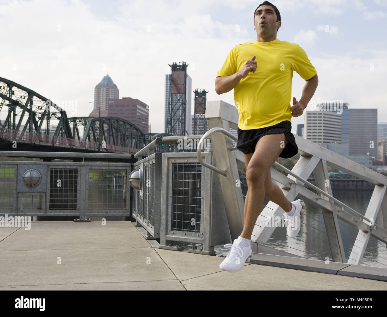 Low angle view of a mid adult man running Stock Photo - Alamy