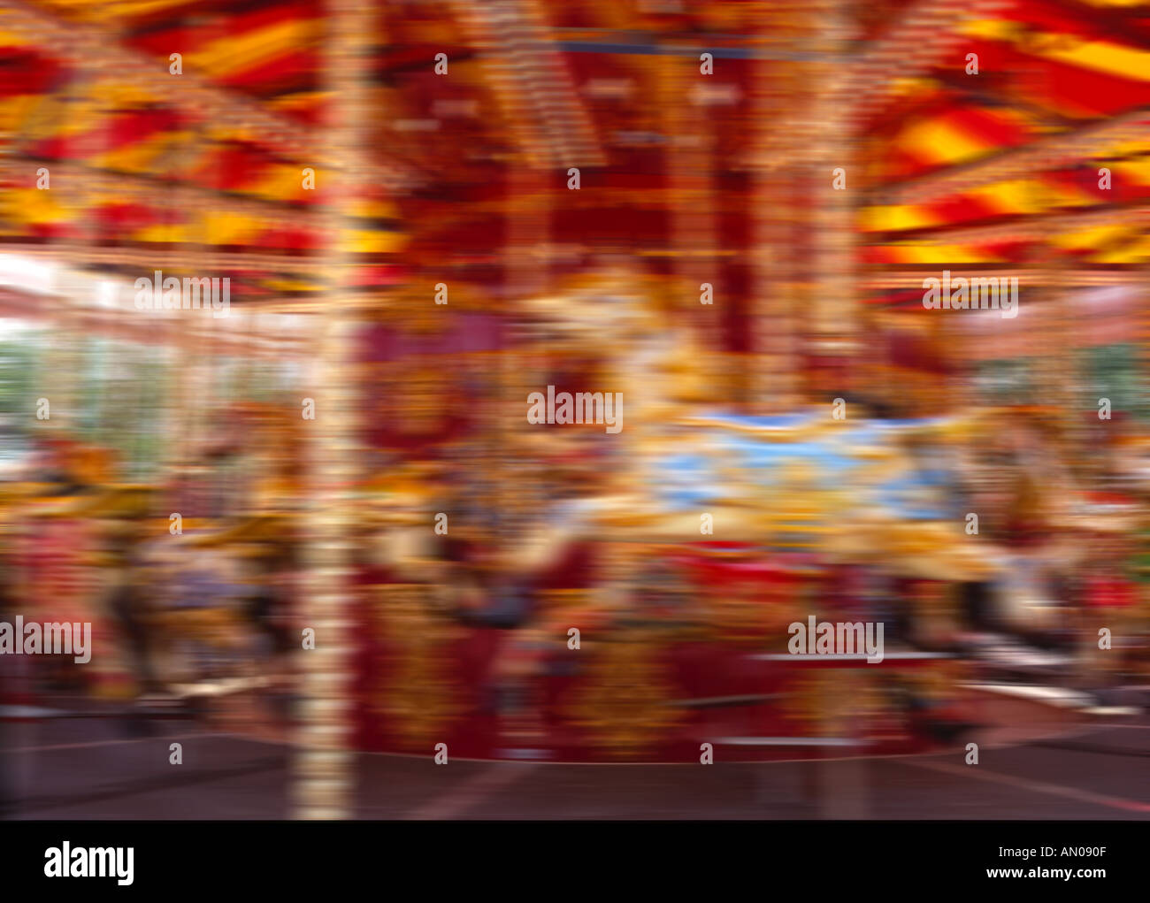 bright moving merry go round fair Stock Photo - Alamy