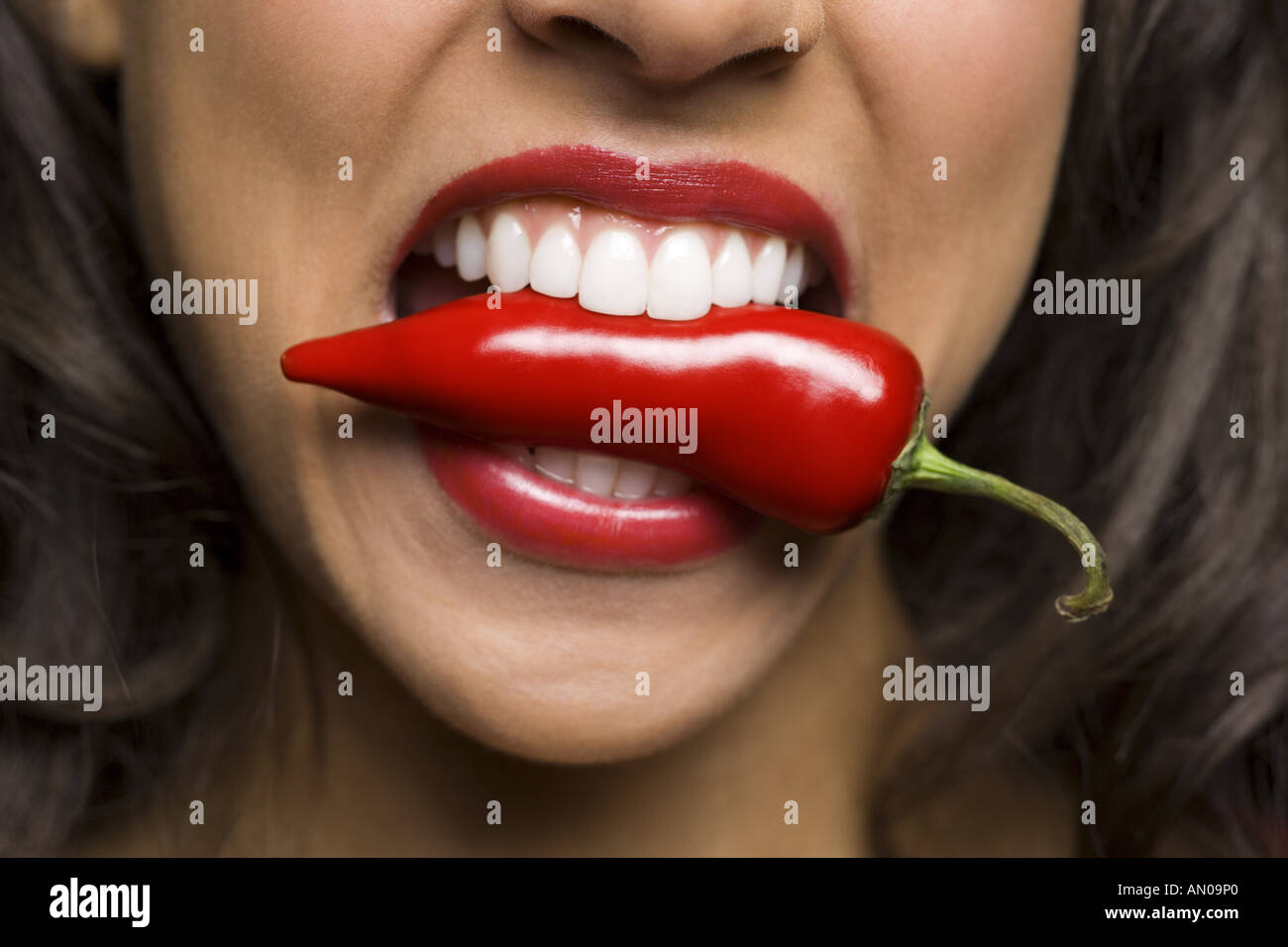 Biting a chili hi-res stock photography and images - Alamy