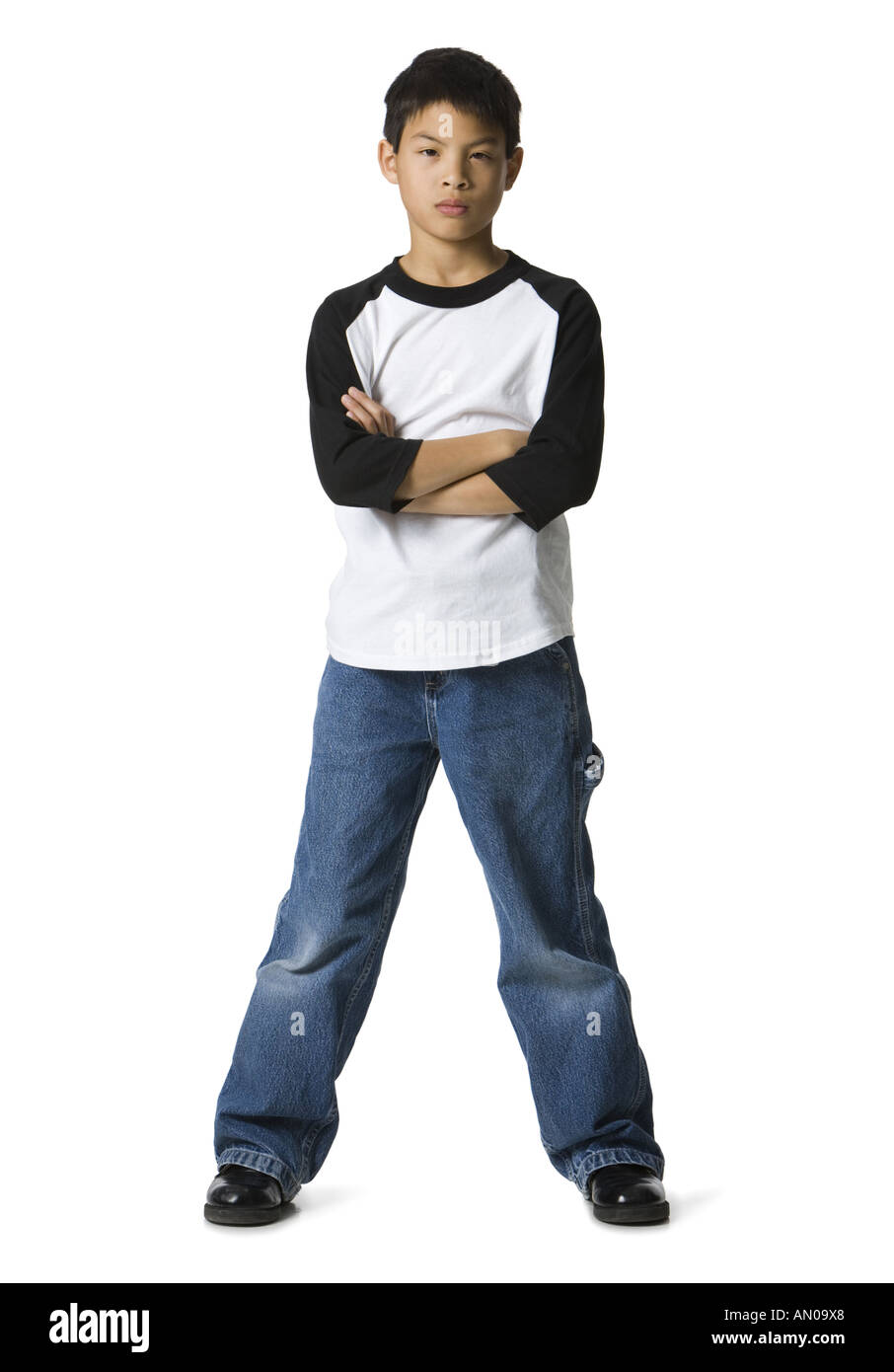 Portrait of a boy standing with his arms crossed Stock Photo - Alamy