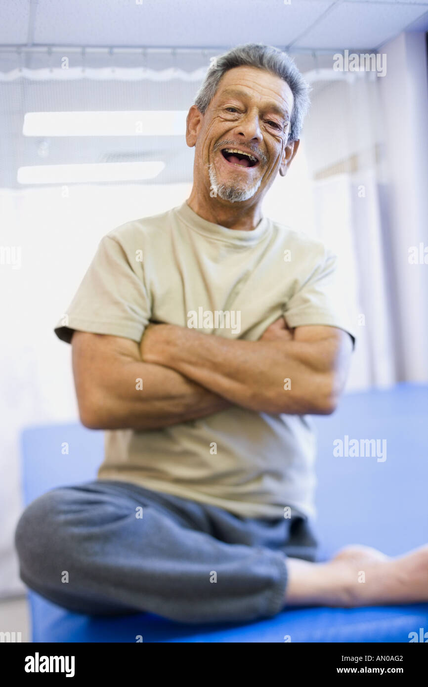 Portrait of a physically challenged senior man laughing Stock Photo - Alamy